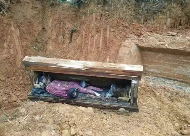 Centuries-old corpse buried with favourite fan discovered nearly ...